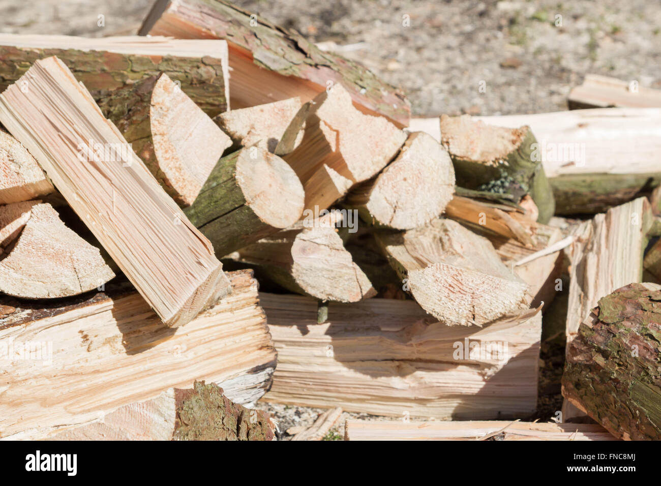 Sticks logs and firewood stacked Stock Photo - Alamy