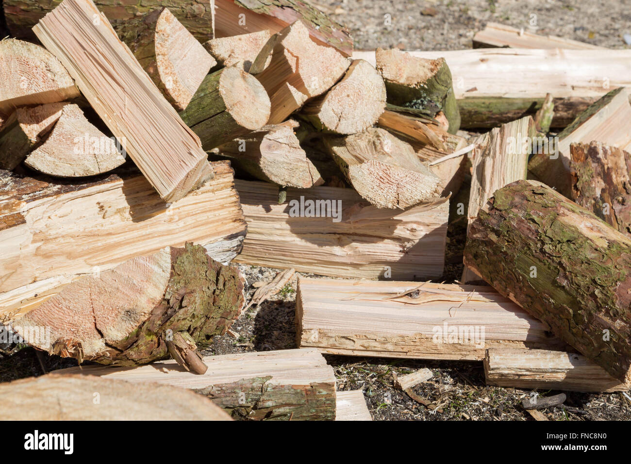 Sticks logs and firewood stacked Stock Photo - Alamy