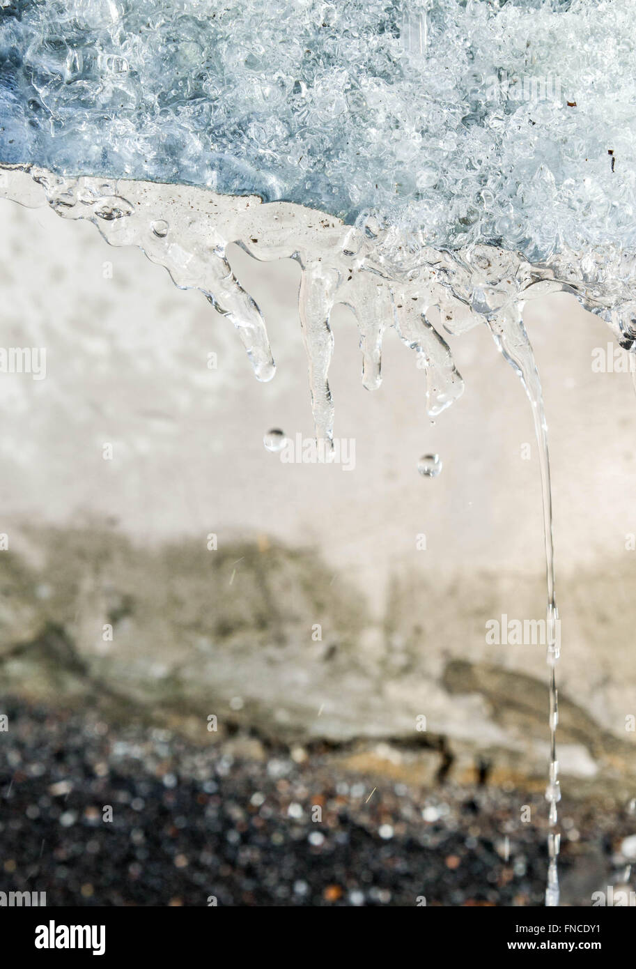 The water flow through the icicles Stock Photo - Alamy
