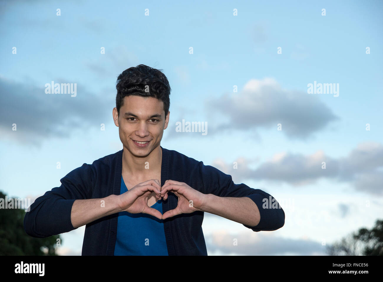Young happy man having fun outdoors Stock Photo - Alamy