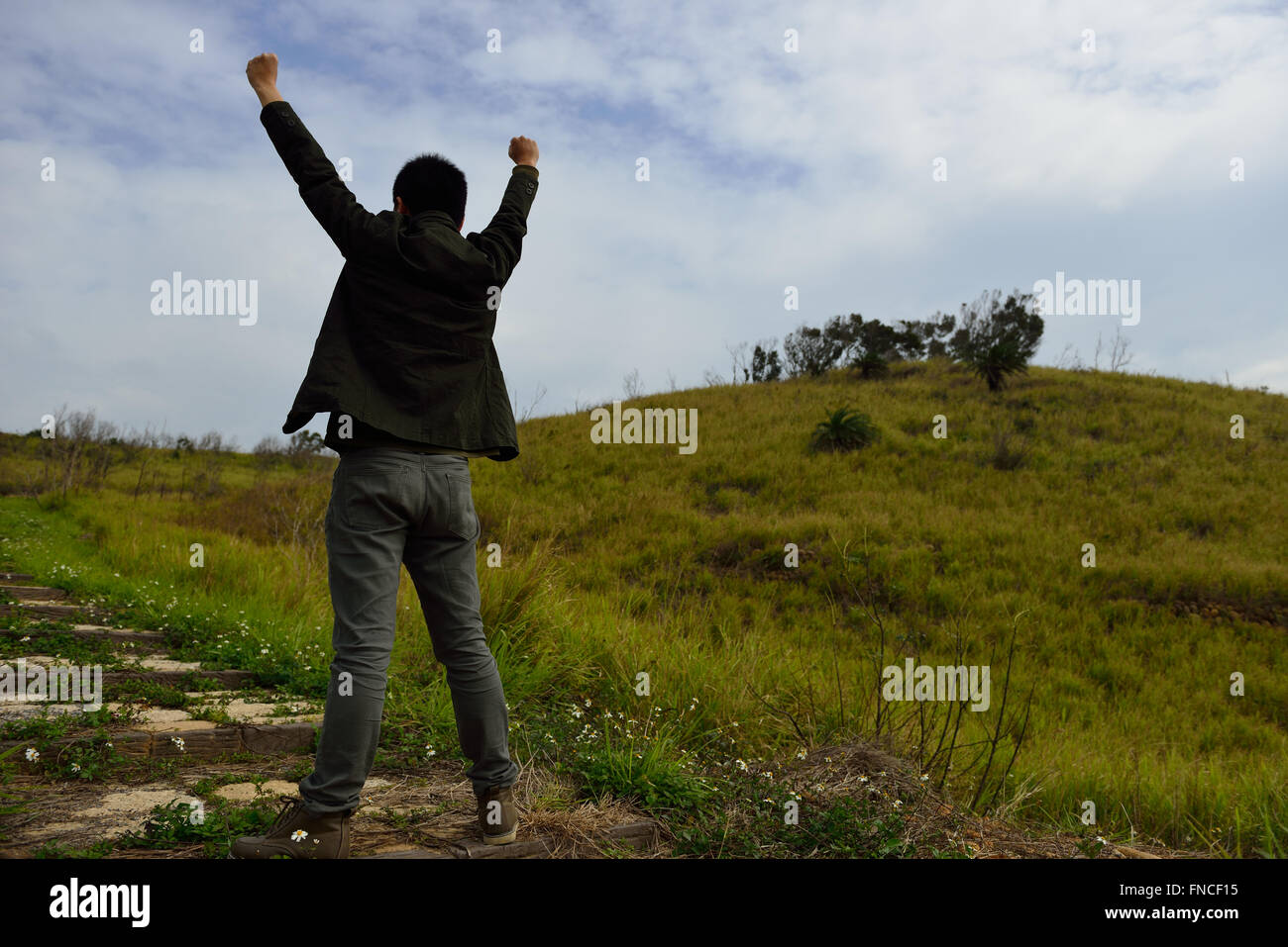 man standing with hands up /Future / freedom / hope / success concept ...