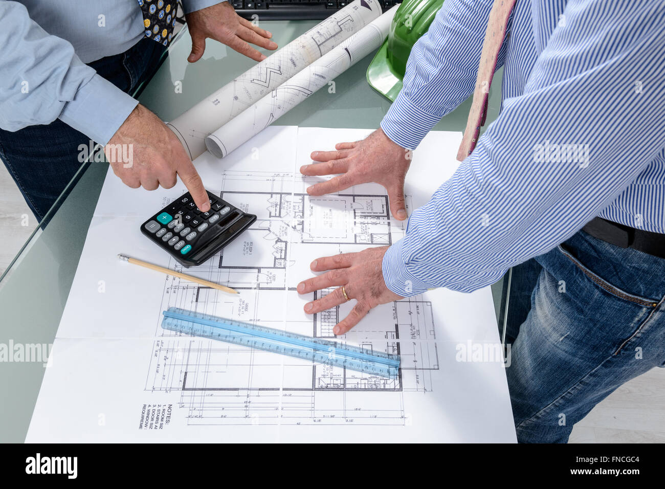 Designers who work in their studio with a project work plan. Closeup ...