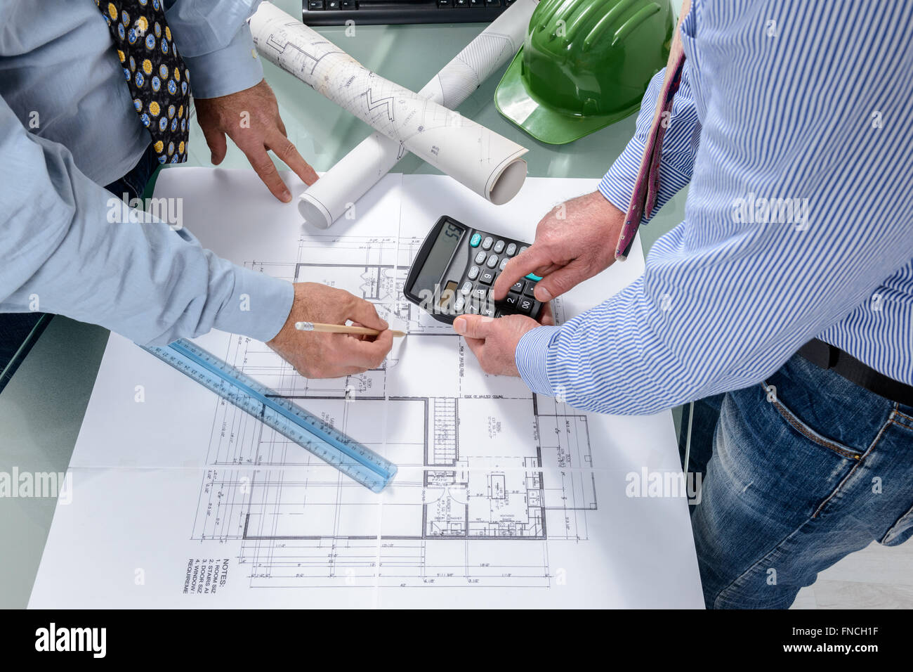 Designers who work in their studio with a project work plan. Closeup ...