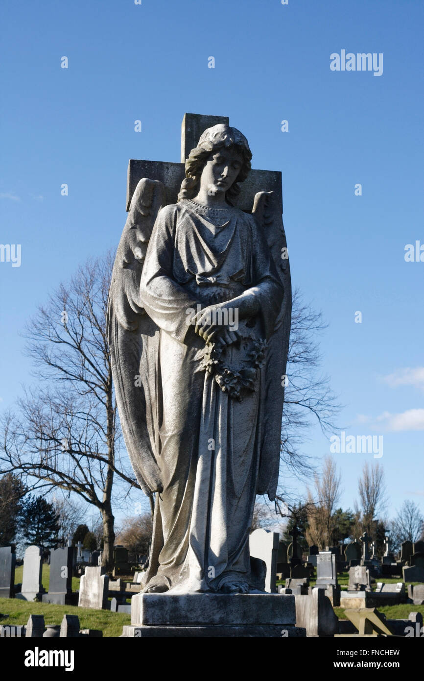 Cemetery angel statue sculpture on a grave UK Stock Photo - Alamy