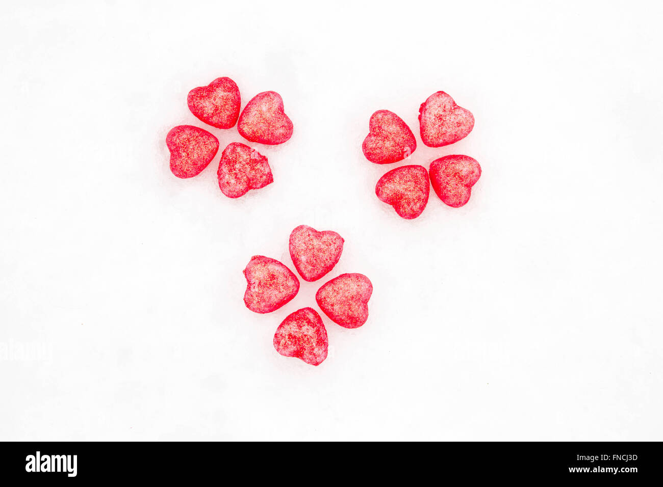 Pink hearts in the snow Stock Photo - Alamy