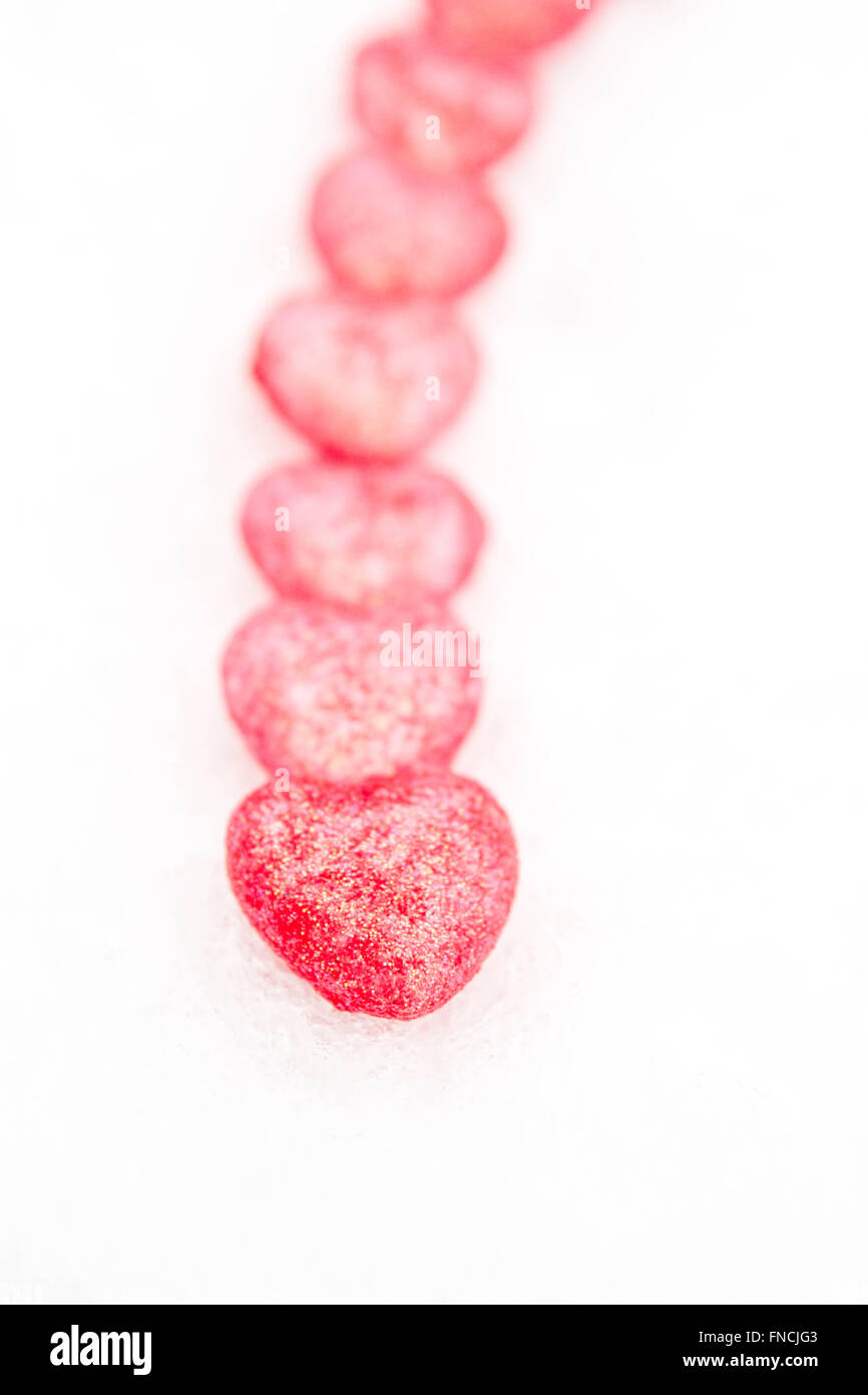 Pink hearts in the snow Stock Photo - Alamy