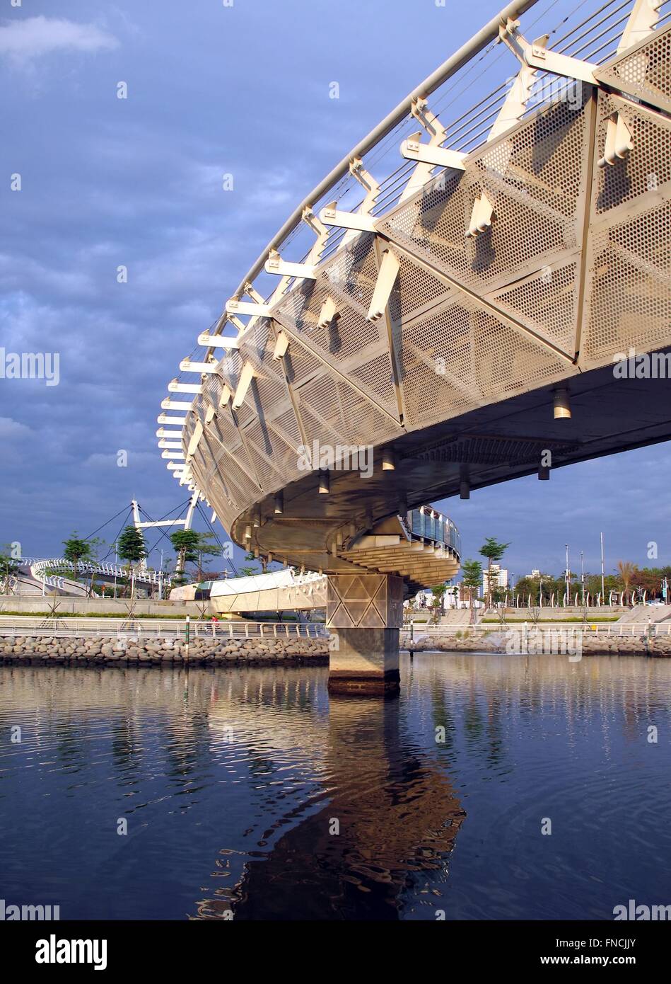 Curved pedestrian bridge located in a park in Kaohsiung, Taiwan Stock ...