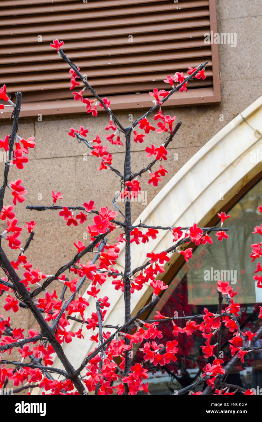 Street red luminous decorative tree Stock Photo - Alamy