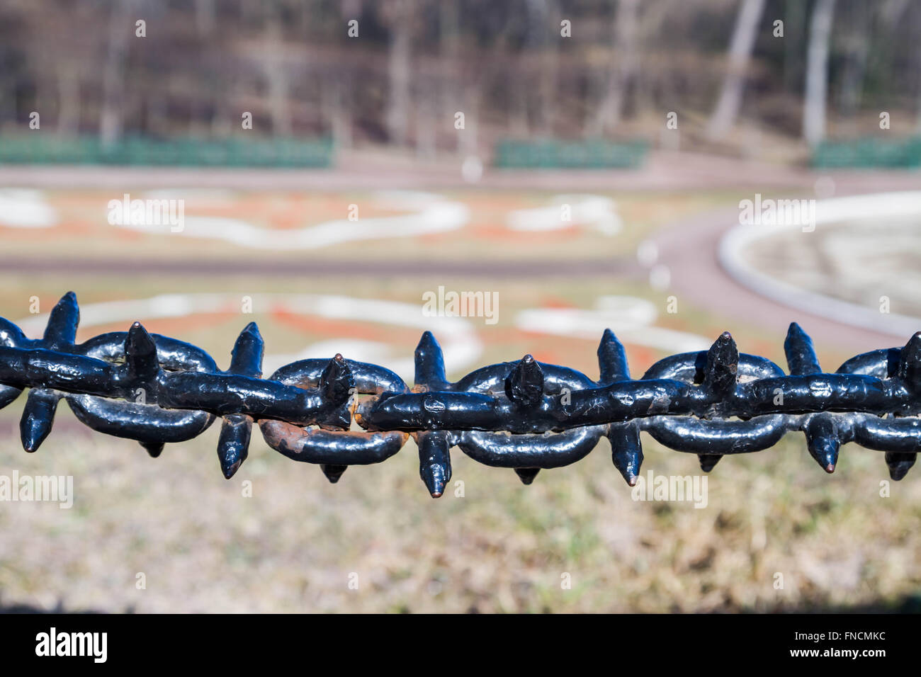 Decorative fence hanging chain obstruction Stock Photo - Alamy