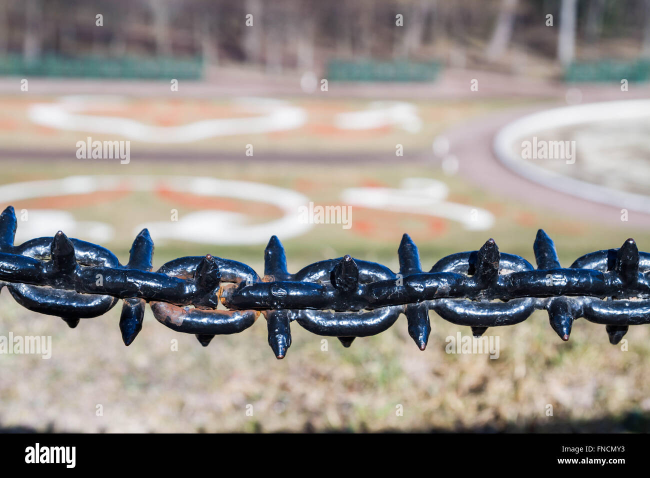 Decorative fence hanging chain obstruction Stock Photo - Alamy