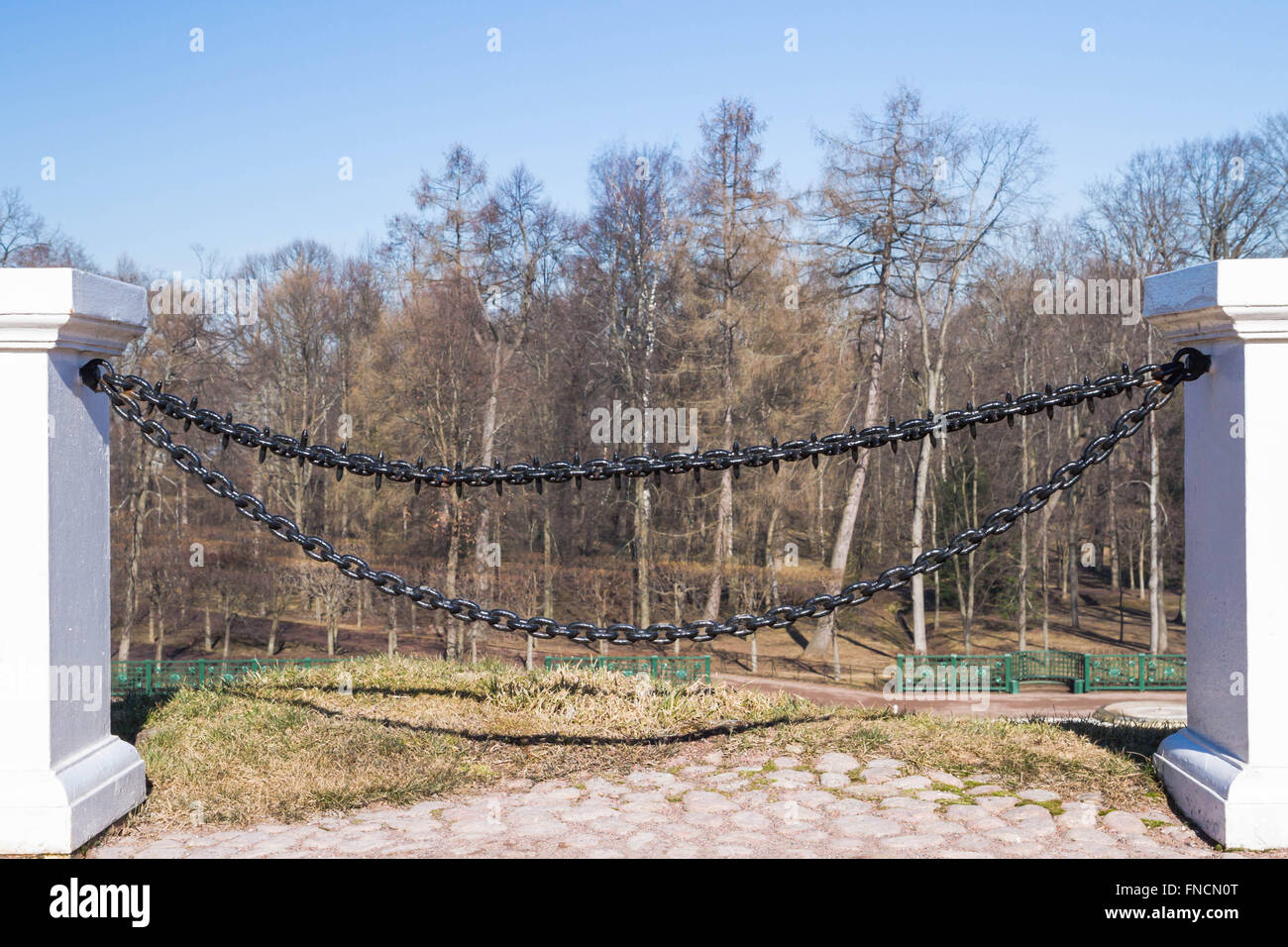 Decorative fence hanging chain obstruction Stock Photo - Alamy