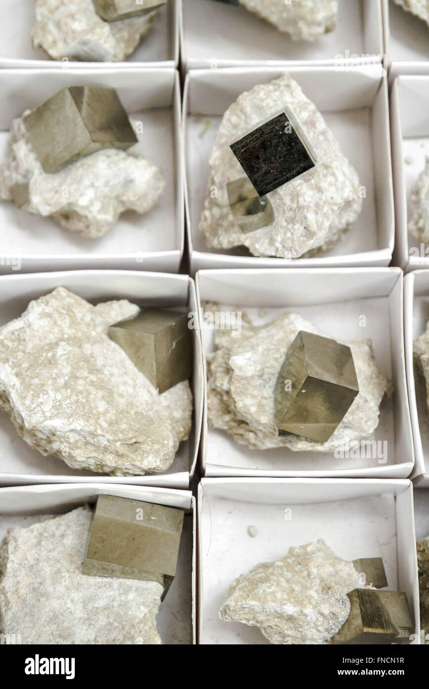 Natural pyrite stone in white box Stock Photo - Alamy
