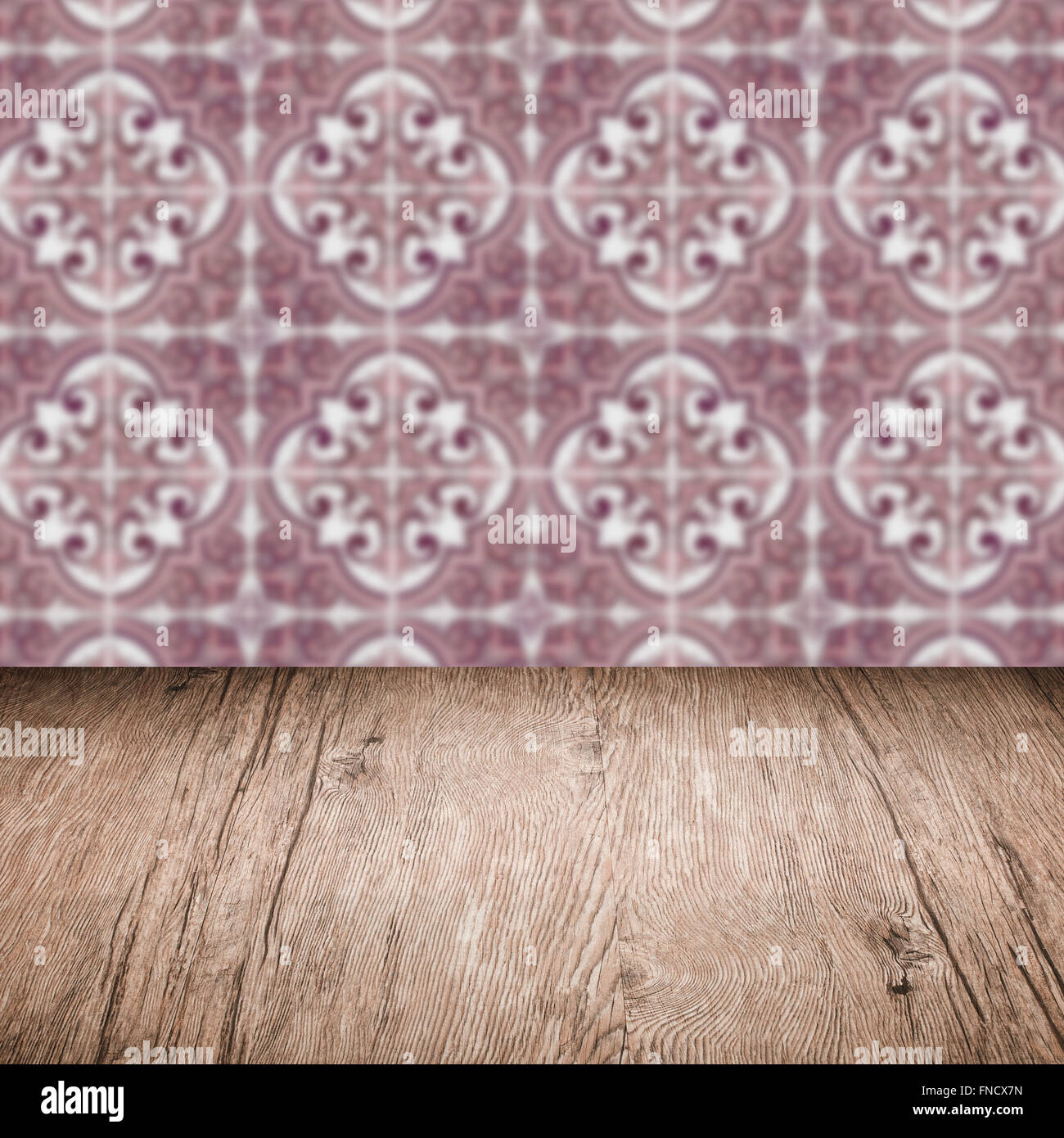 Empty wood table top and blur vintage ceramic tile pattern wall in ...