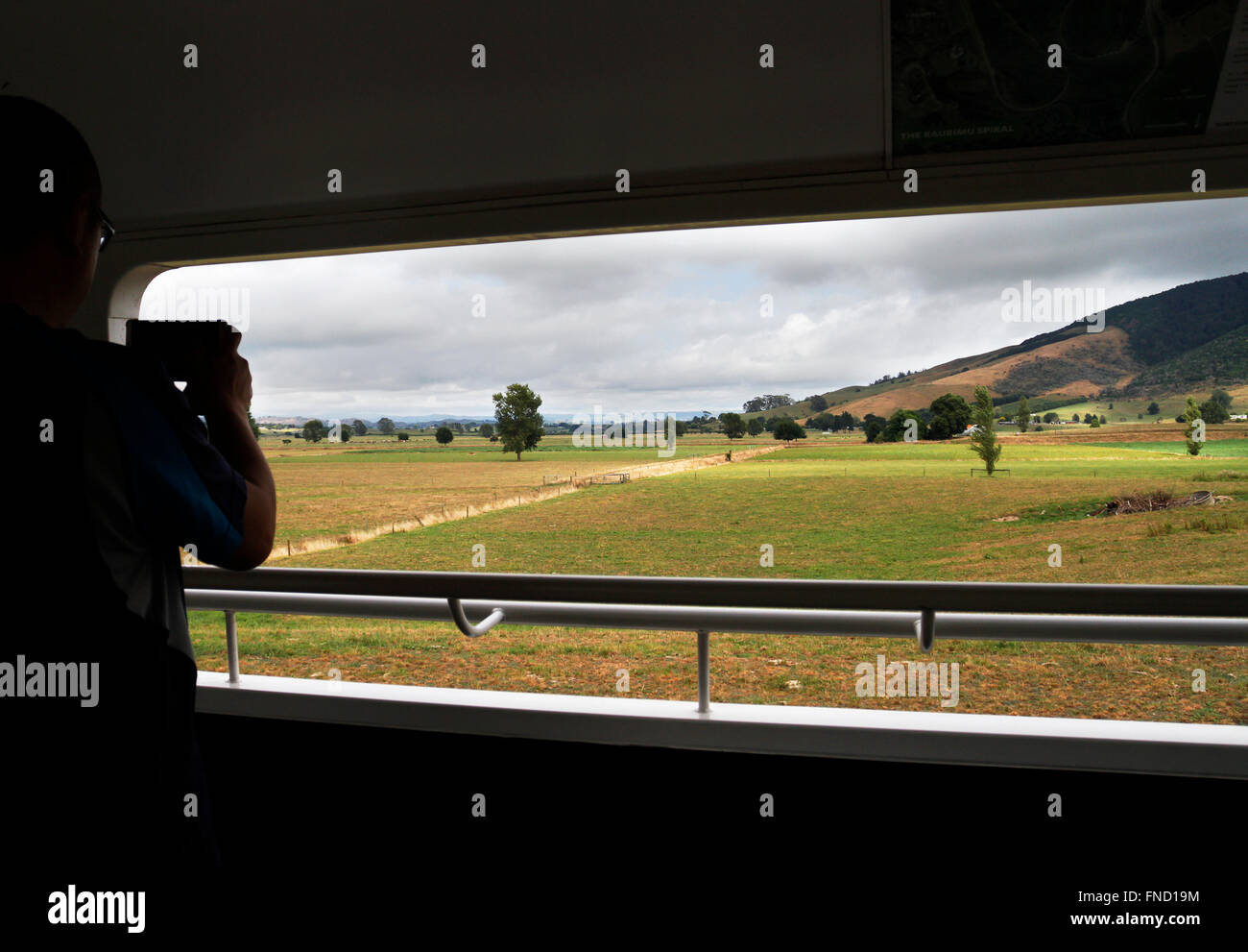 A passenger taking photo from inside the open coach of Northern ...