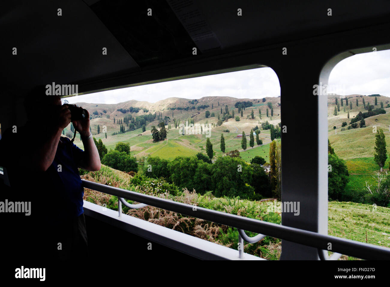 A passenger taking photo from inside the open coach of Northern ...
