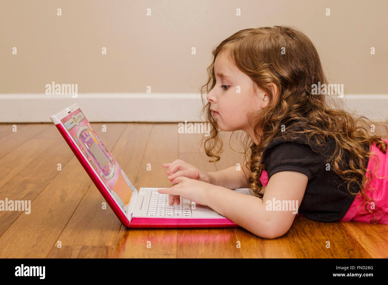 a little girl on her computer Stock Photo - Alamy