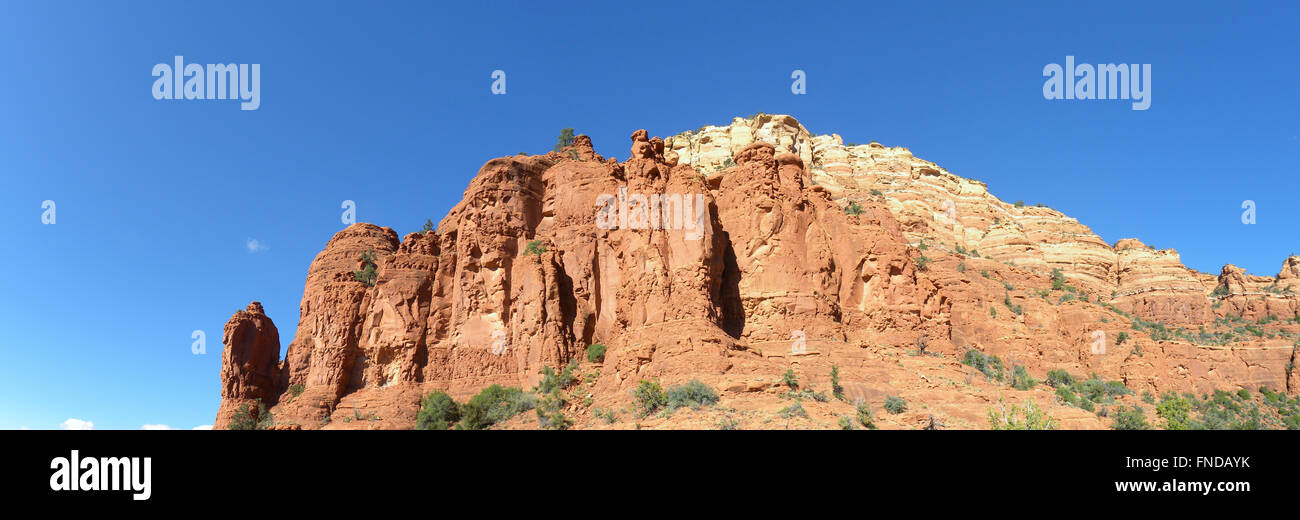 Steep red rock mountains cliffs against blue sky Stock Photo - Alamy