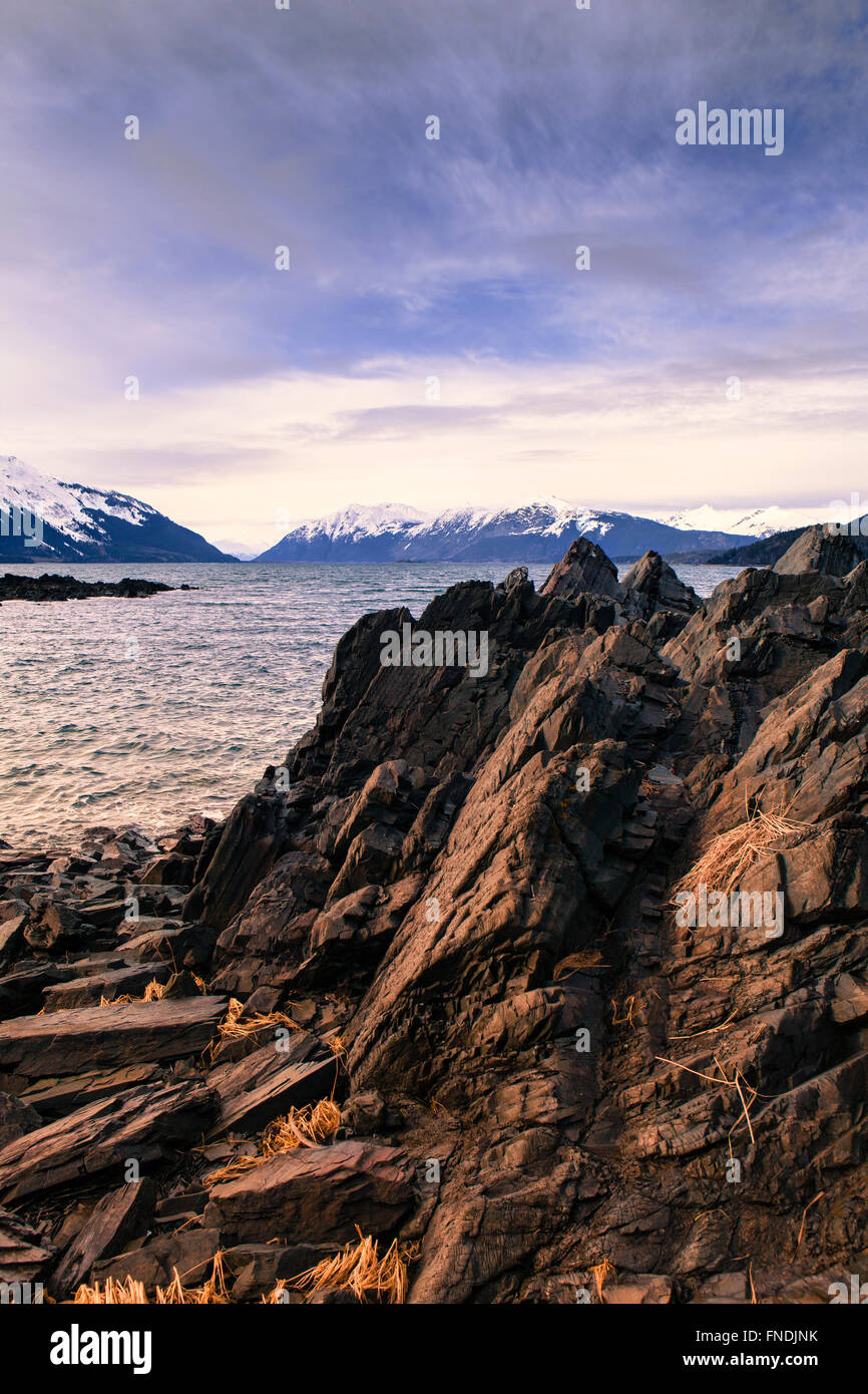 Rocky shore in Southeast Alaska with storm clouds forming Stock Photo ...