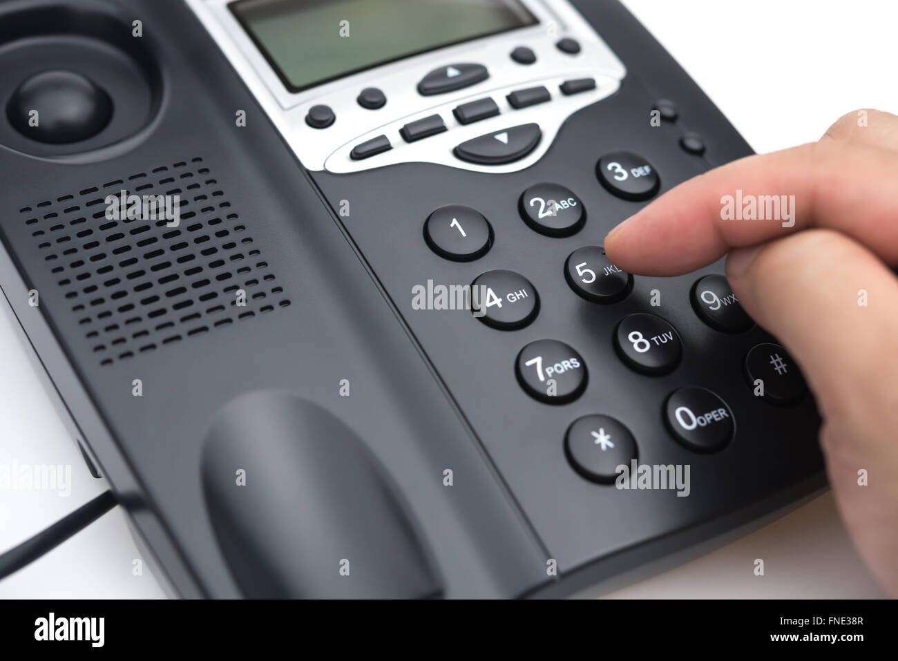 man dialing a black telephone close up Stock Photo - Alamy