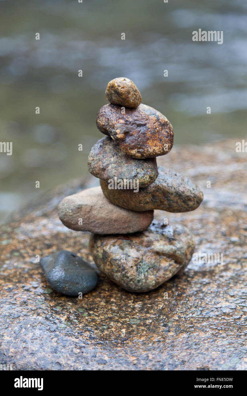 Wet stones stacked by the river Stock Photo - Alamy