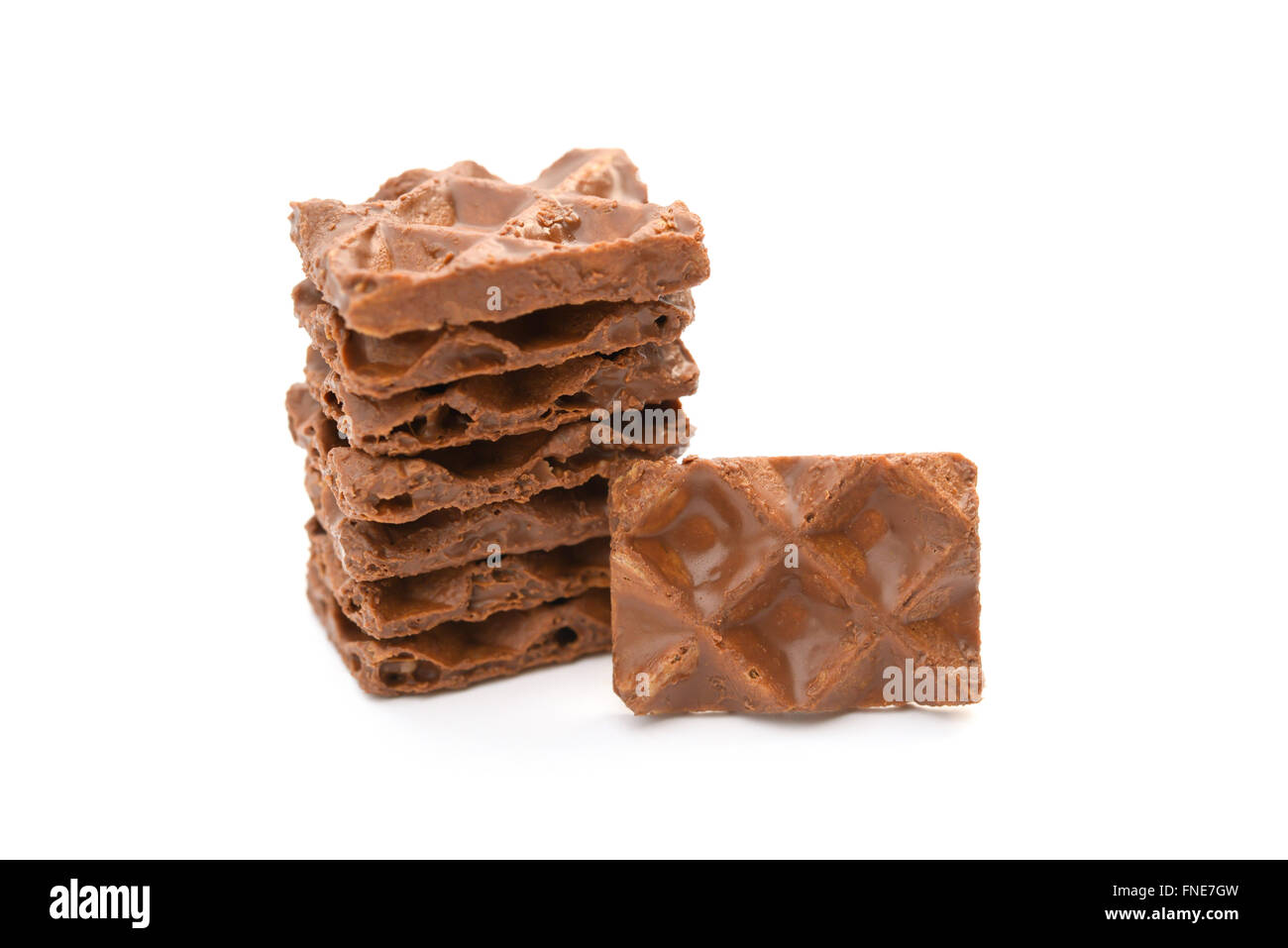 chocolate blocks stack up on a white background Stock Photo - Alamy