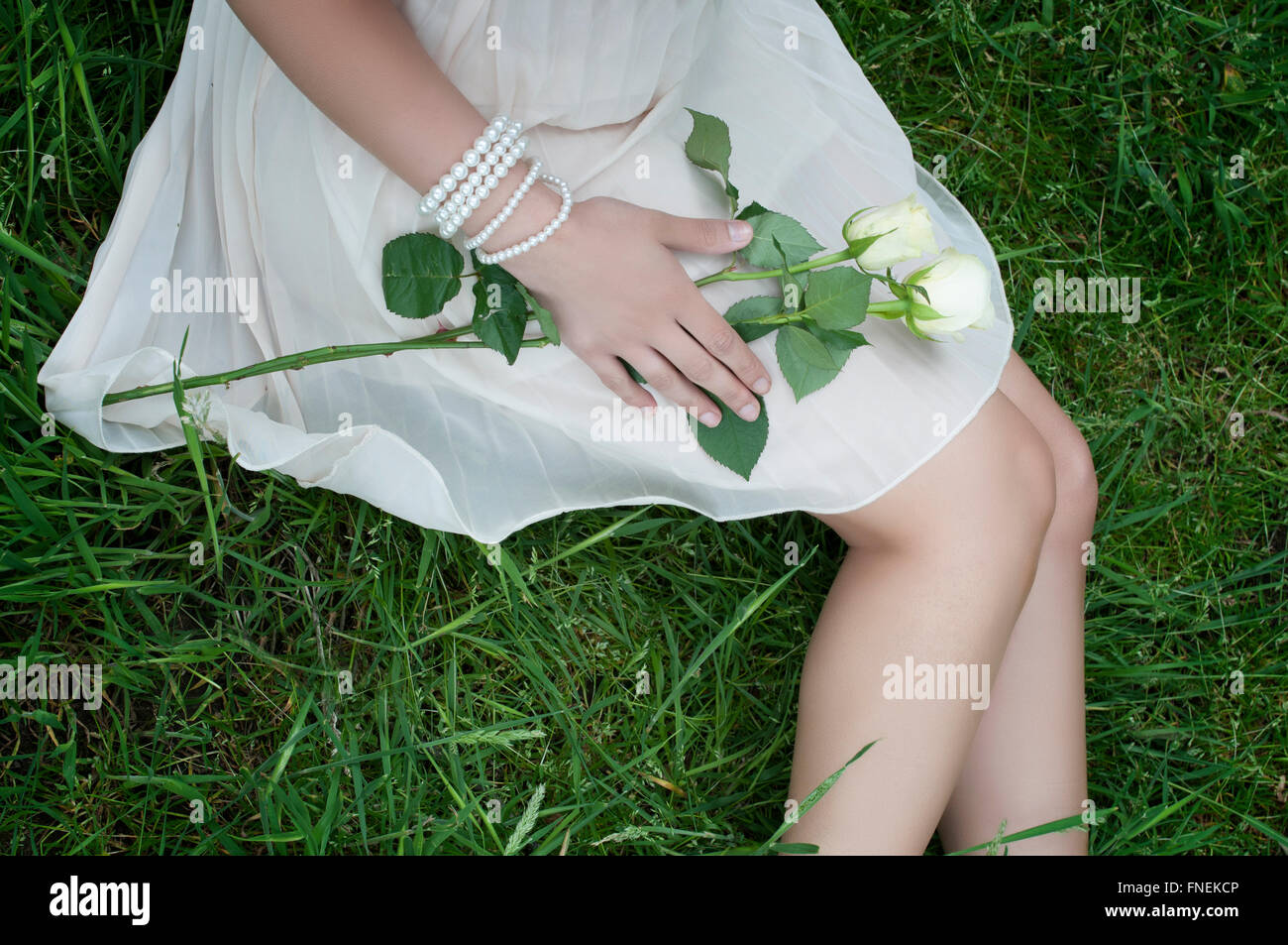 Beauty legs woman flowers hand hi-res stock photography and images - Alamy