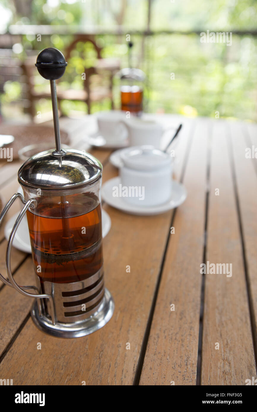 Tea press with cups of tea and cane sugar at resort in Malaysia (Asia ...