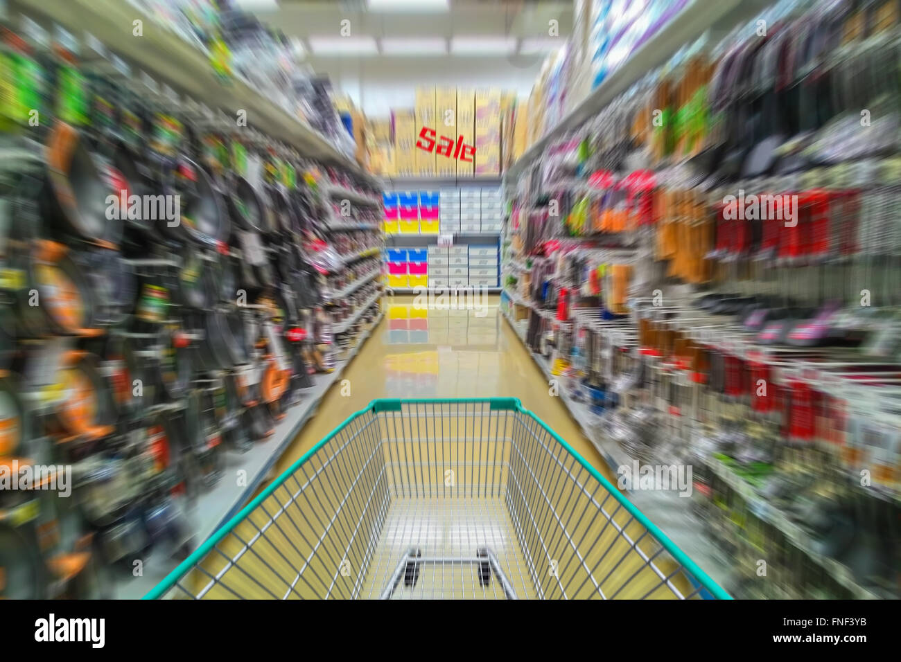 Running shopping cart in supermarket has sale wares in destinations ...