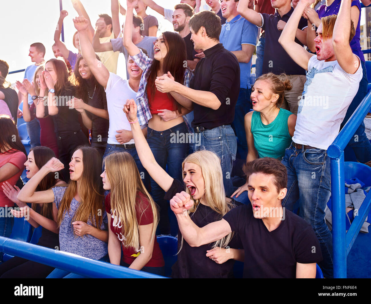 Sport fans clapping and singing on tribunes Stock Photo - Alamy