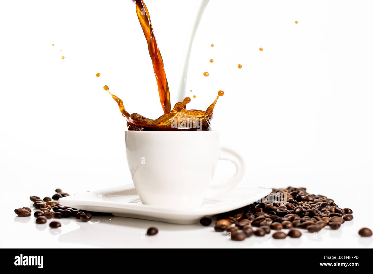 White cup of coffee splash on white background Stock Photo - Alamy