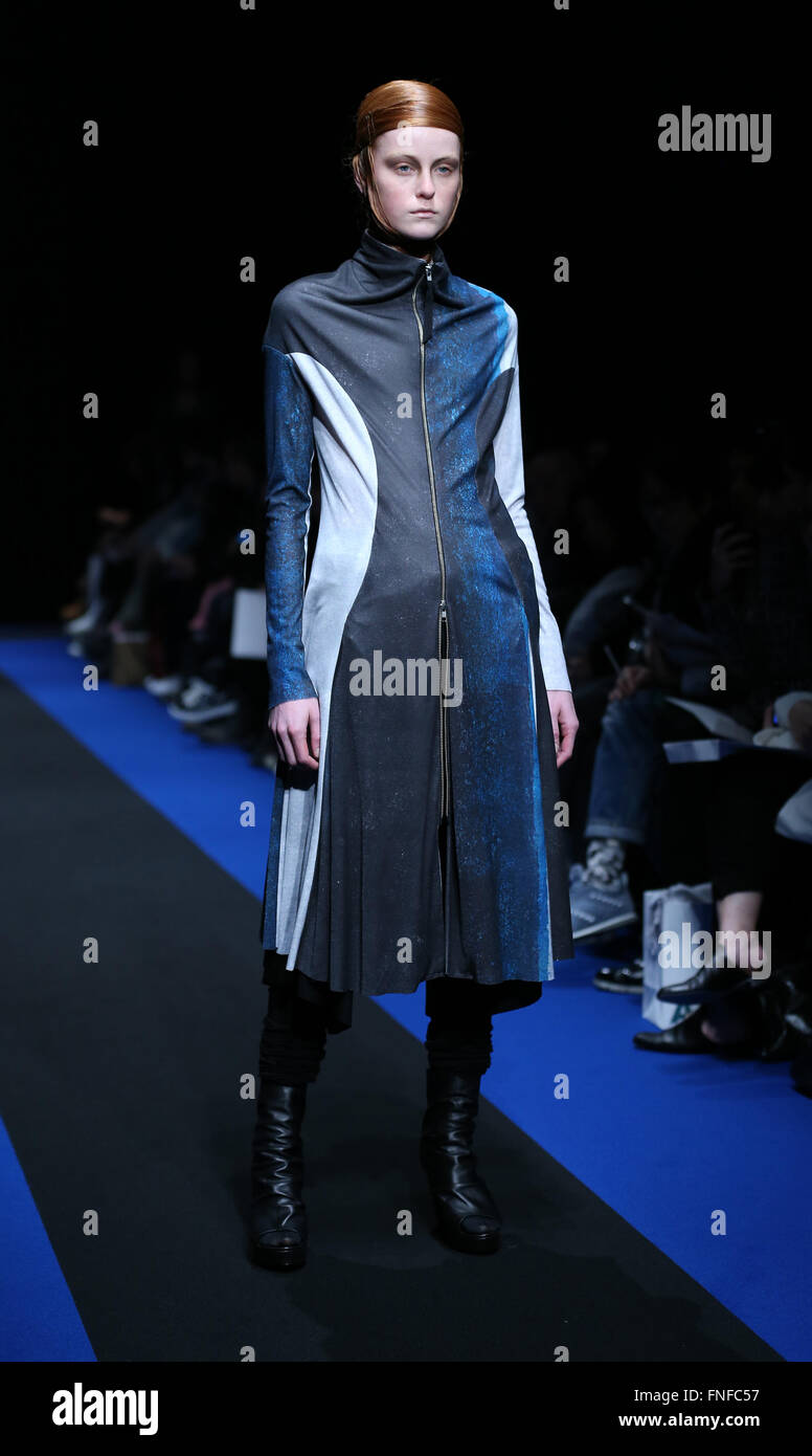 Tokyo, Japan. 15th Mar, 2016. A model displays a creation designed by ...