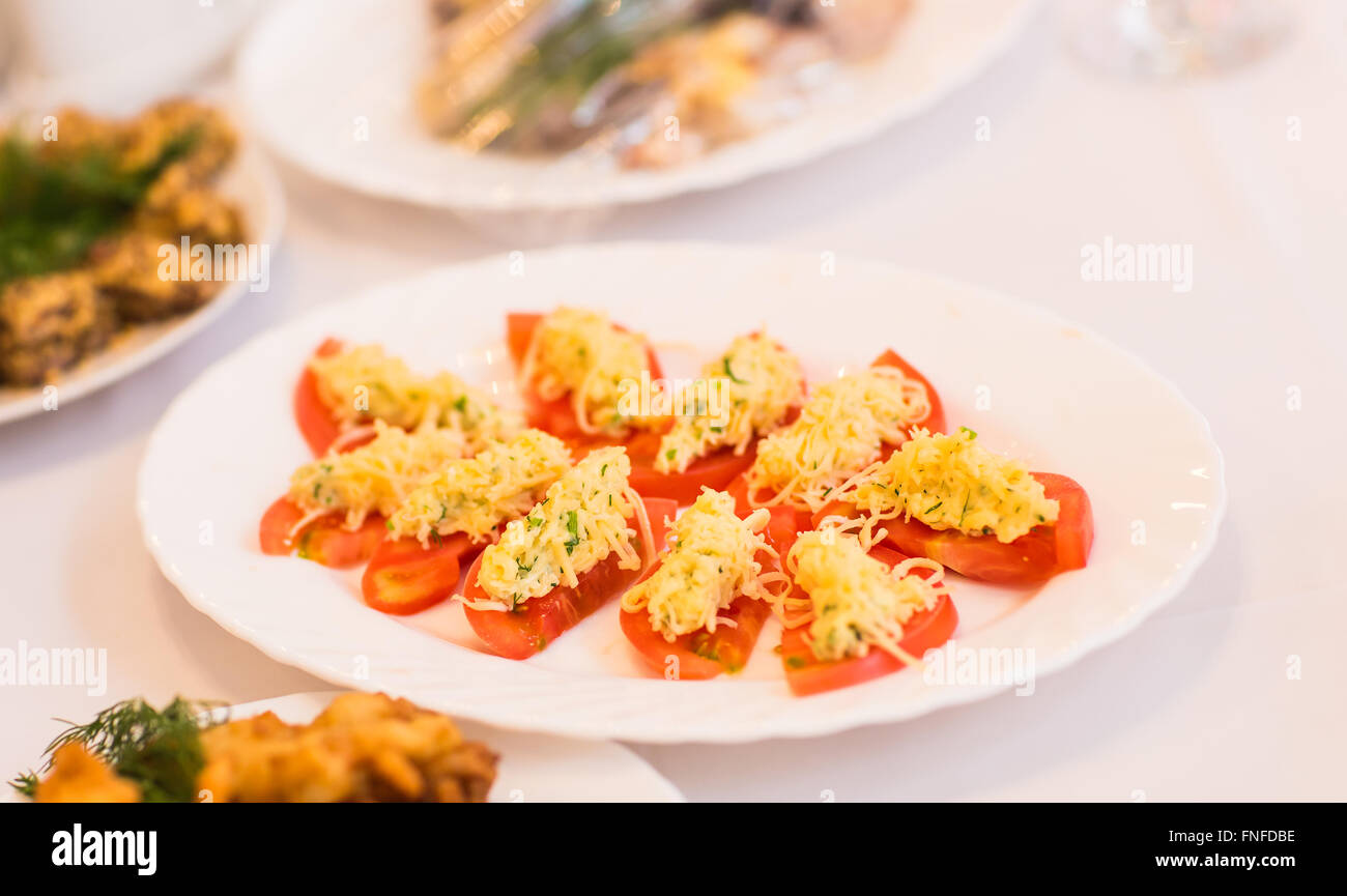 Different tasty snacks for wine on luxury banquet table Stock Photo - Alamy