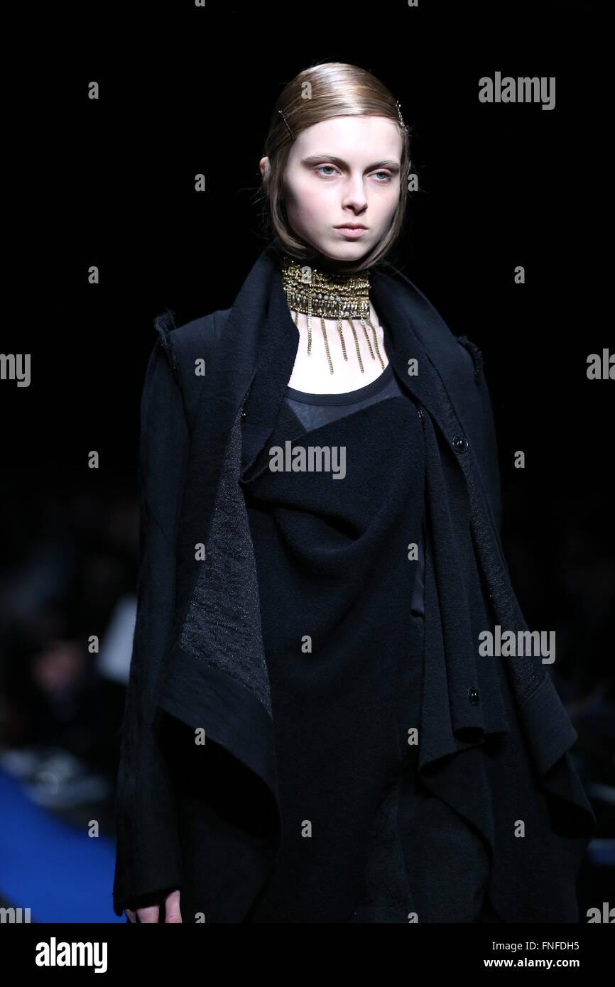 Tokyo, Japan. 15th Mar, 2016. A model displays a creation designed by ...