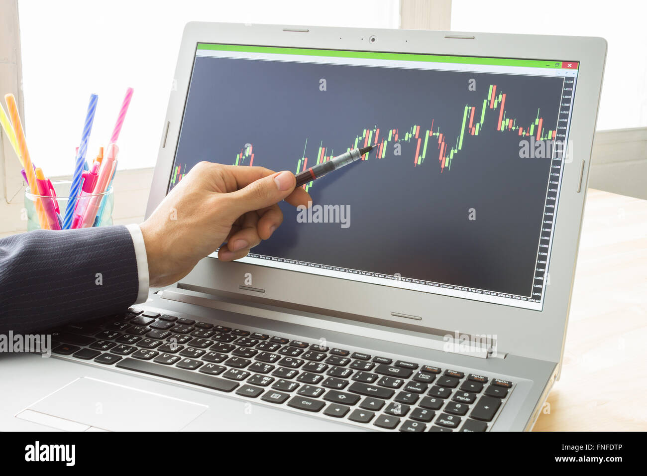 Businessman is pointing stock graph or forex graph . Technical analysis ...