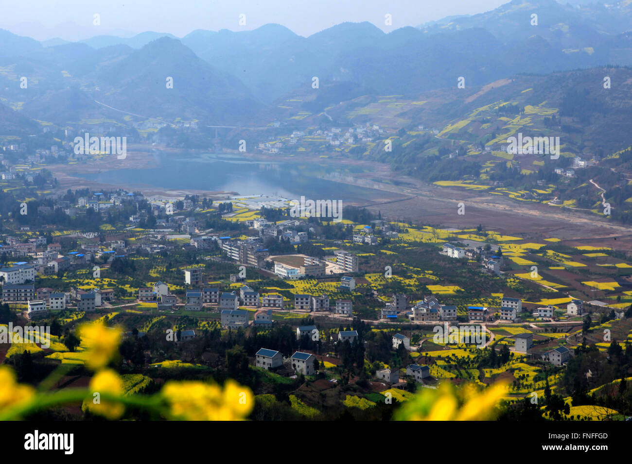 Enshi. 13th Mar, 2016. Photo taken on March 13, 2016 shows houses amid ...