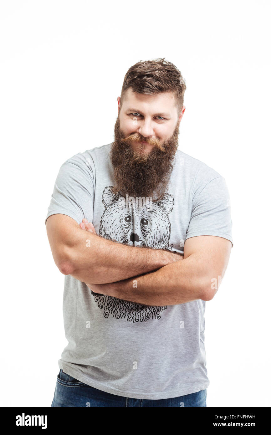 Handsome smiling bearded man standing with arms crossed ver white ...