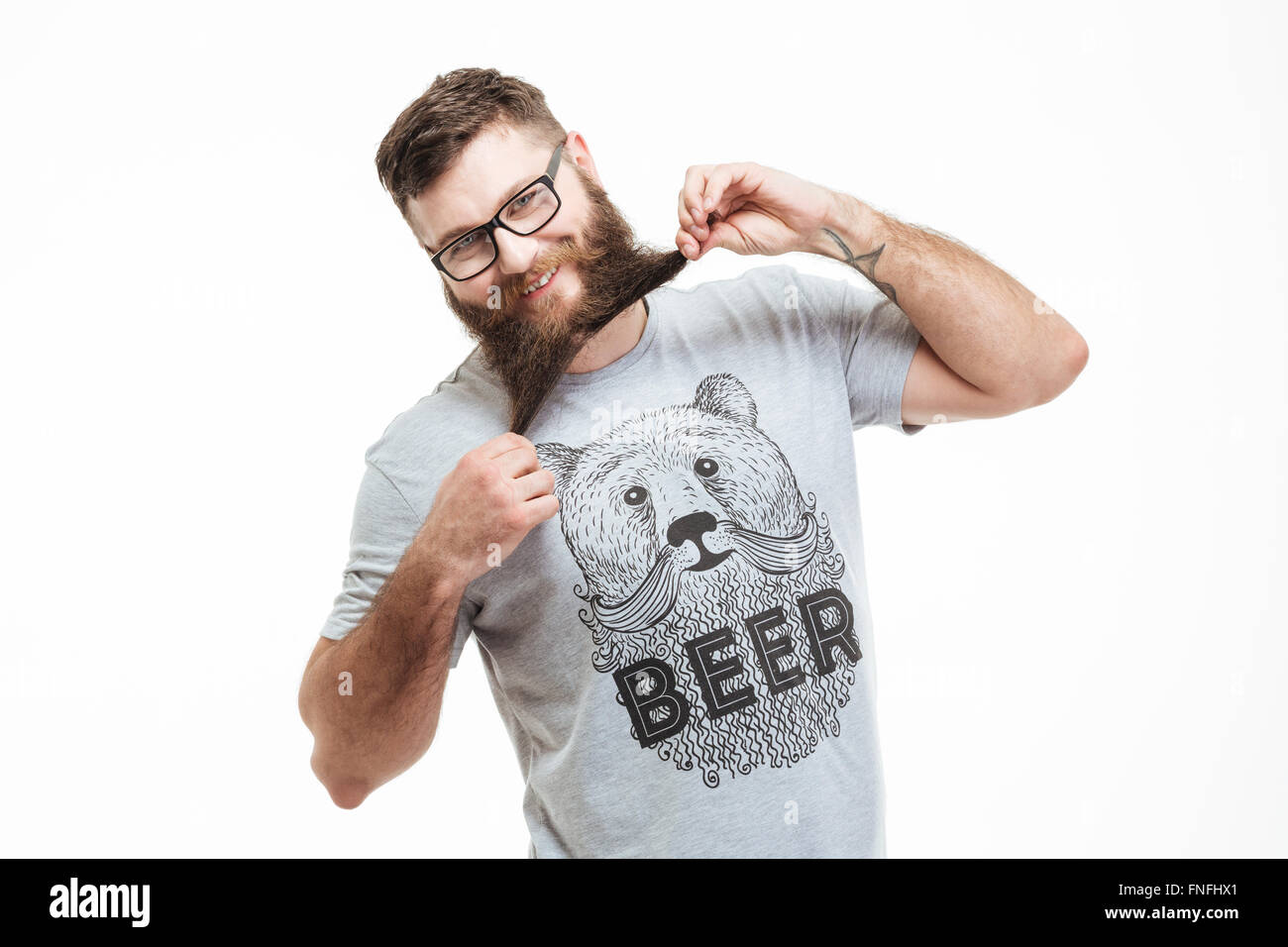 Funny cheerful bearded man standing and having fun over white ...
