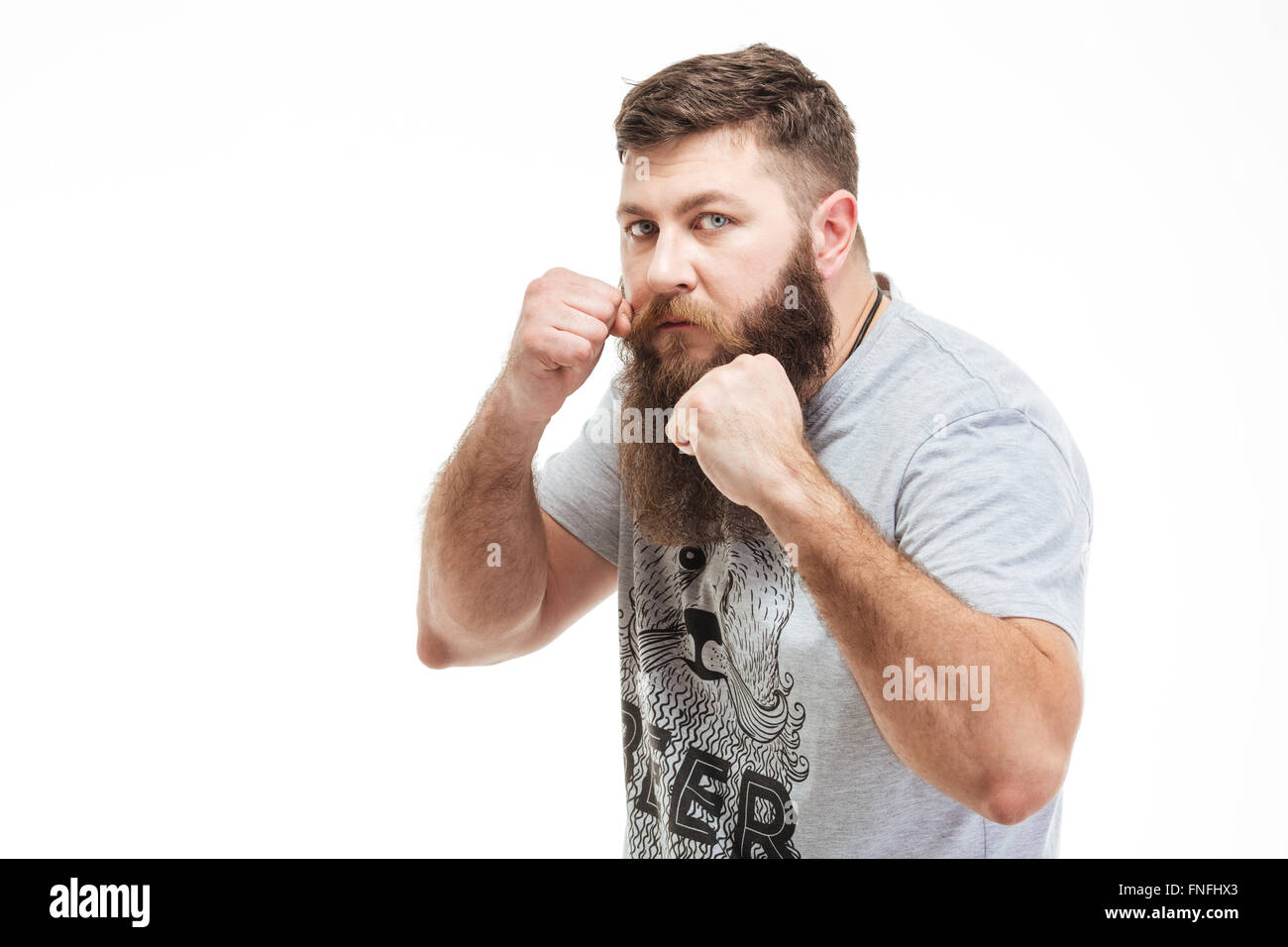 Concentraited handsome young man standing in boxer position and ready ...