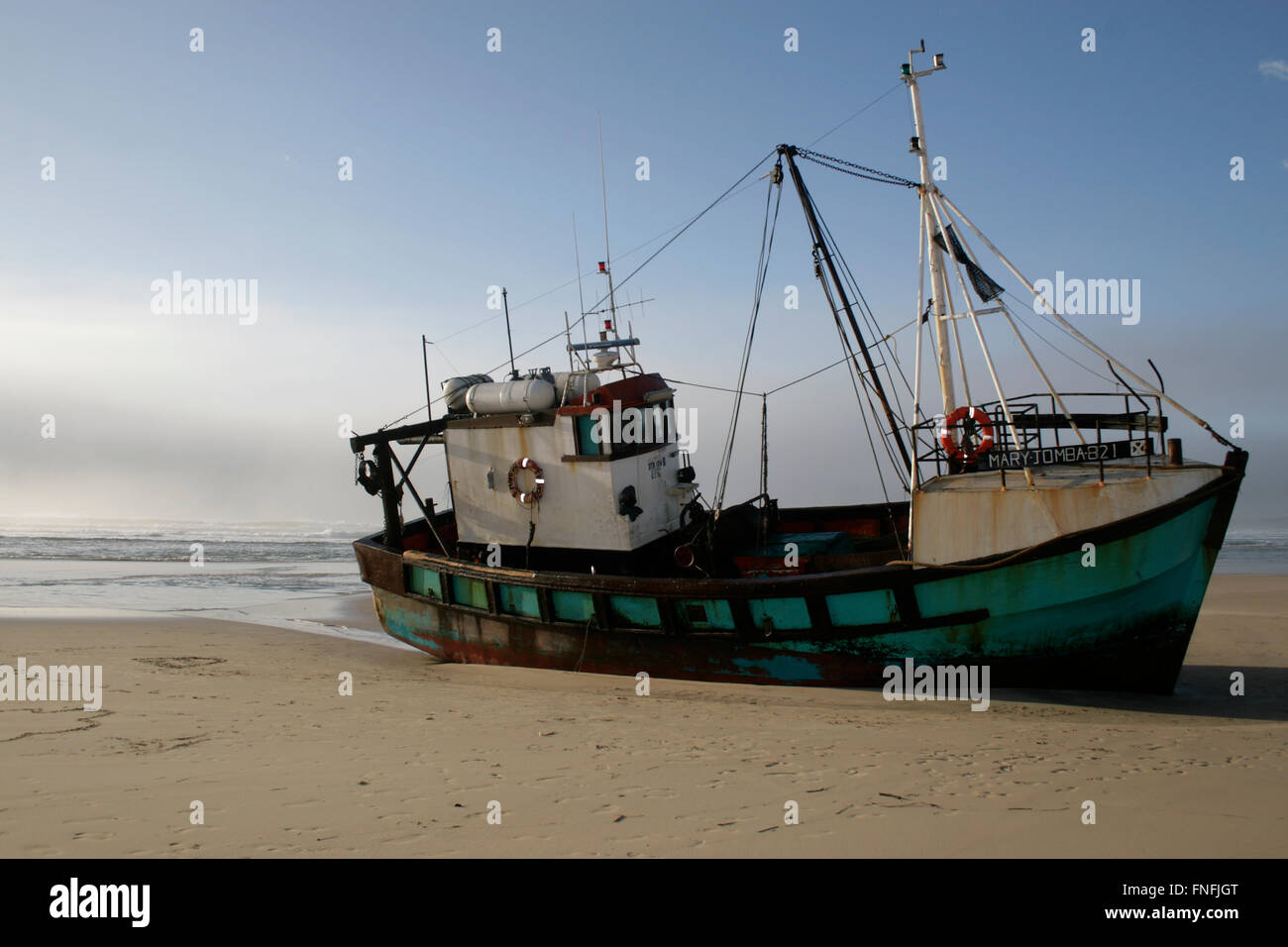 boat stranded on beach Stock Photo - Alamy