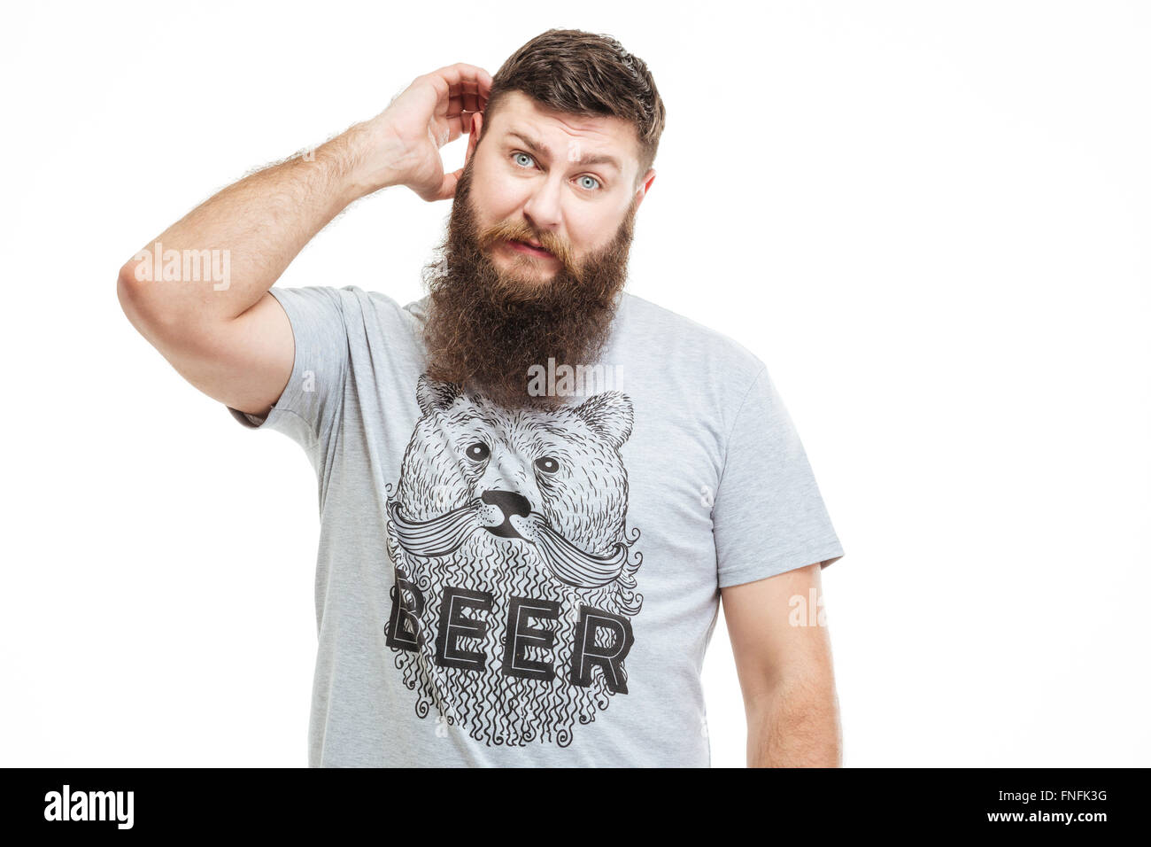 Confused thoughtful bearded man scratching his head over white ...