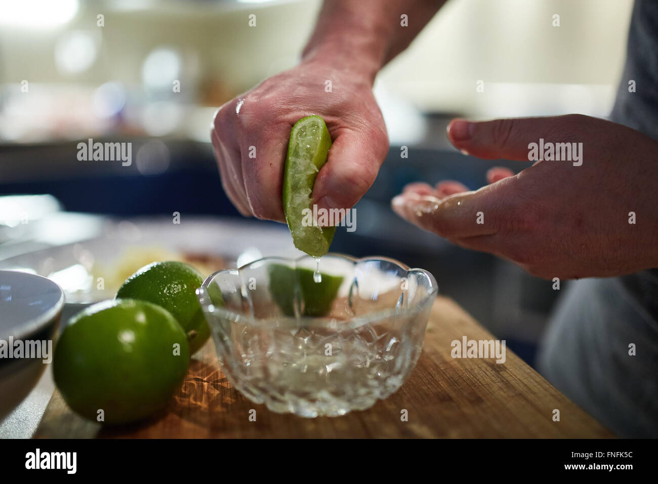 Squeezing lemon in cooking hi-res stock photography and images - Alamy