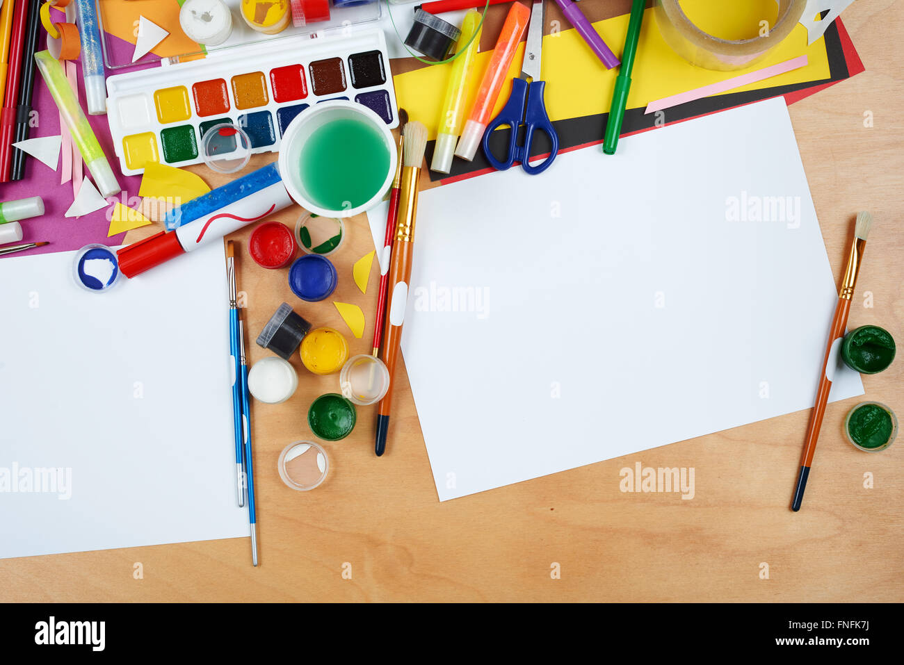 artwork workplace with creative accessories, art tools for painting and ...