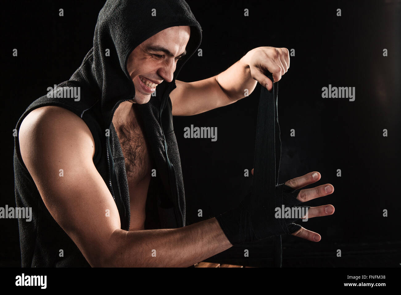 The hands of muscular man with bandage Stock Photo - Alamy