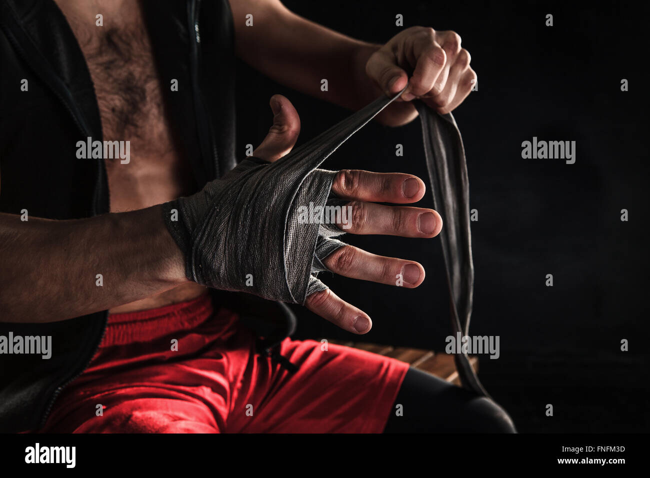 The hands of muscular man with bandage Stock Photo - Alamy