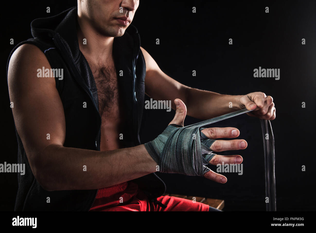 The hands of muscular man with bandage Stock Photo - Alamy