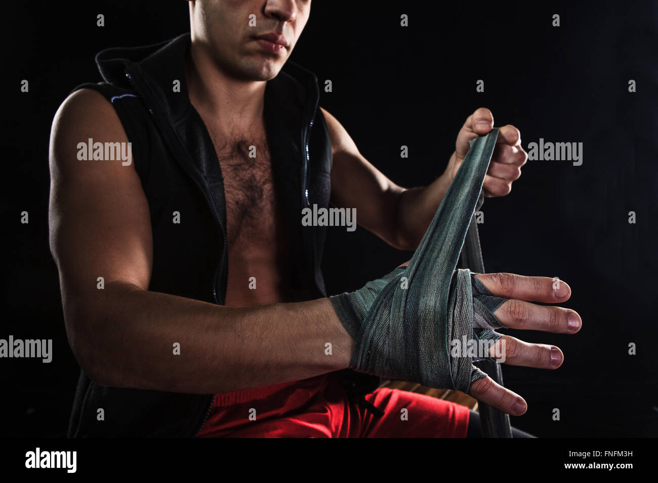 The hands of muscular man with bandage Stock Photo - Alamy