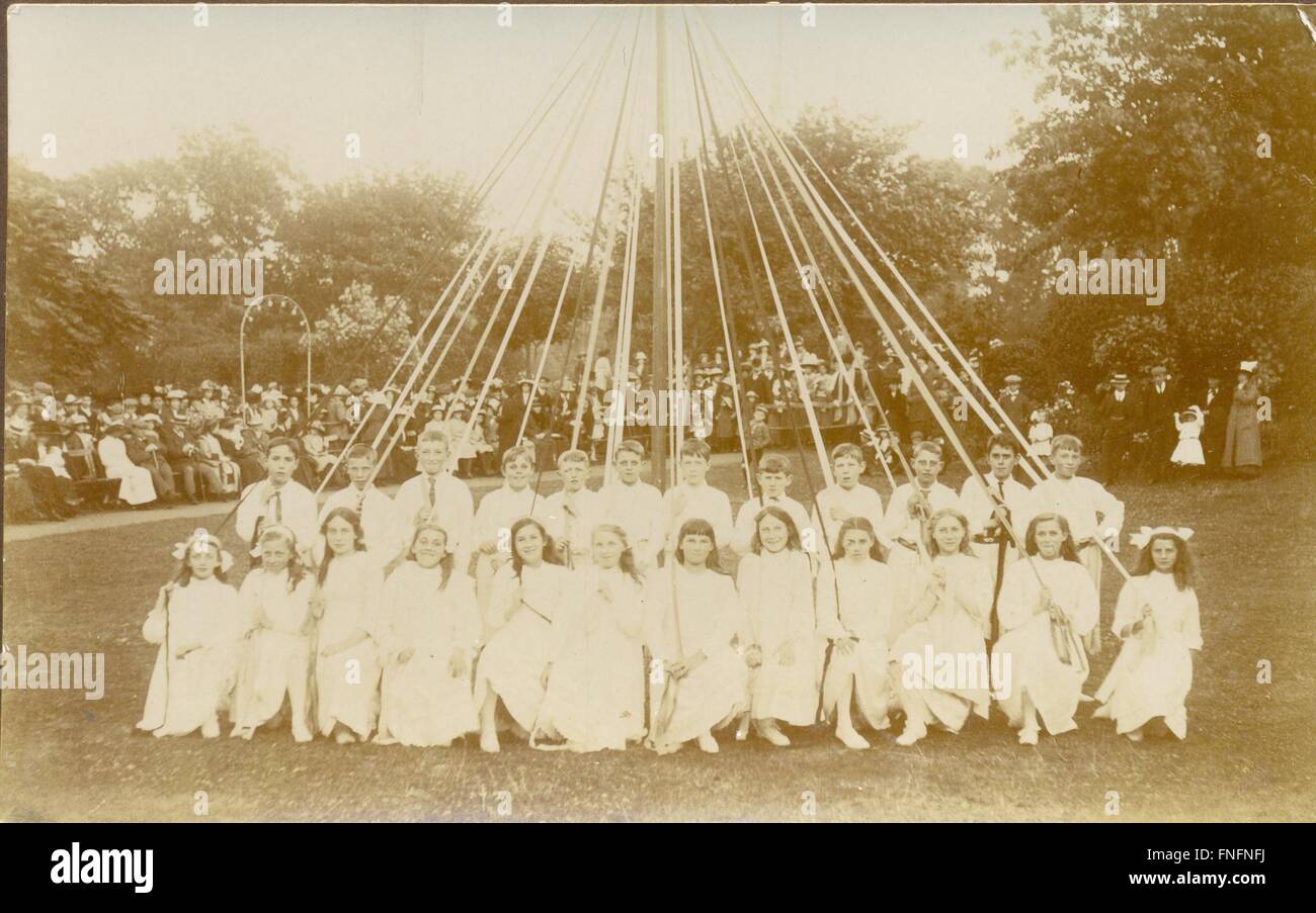 Twenty boys and girls posing with ribbons in front of maypole Stock ...