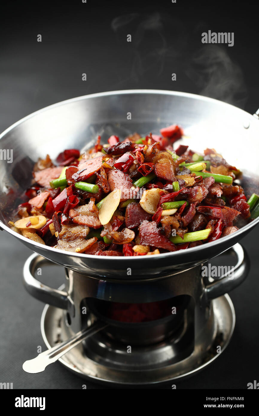 Stir fried meat served in a wok Stock Photo - Alamy