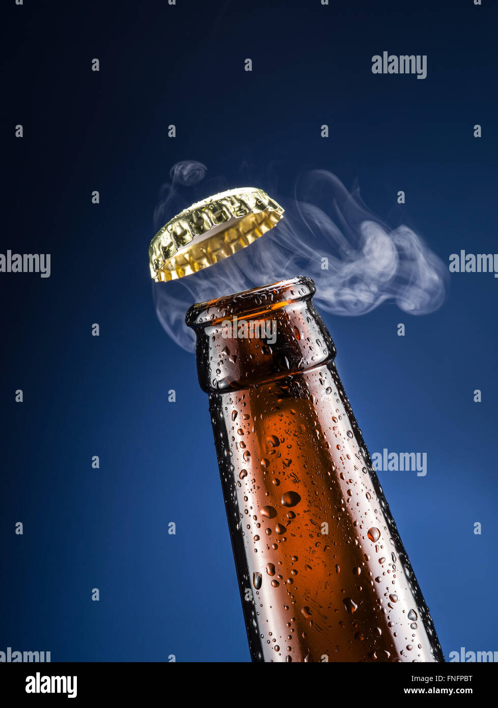 Opening of beer cap with the gas output Stock Photo - Alamy