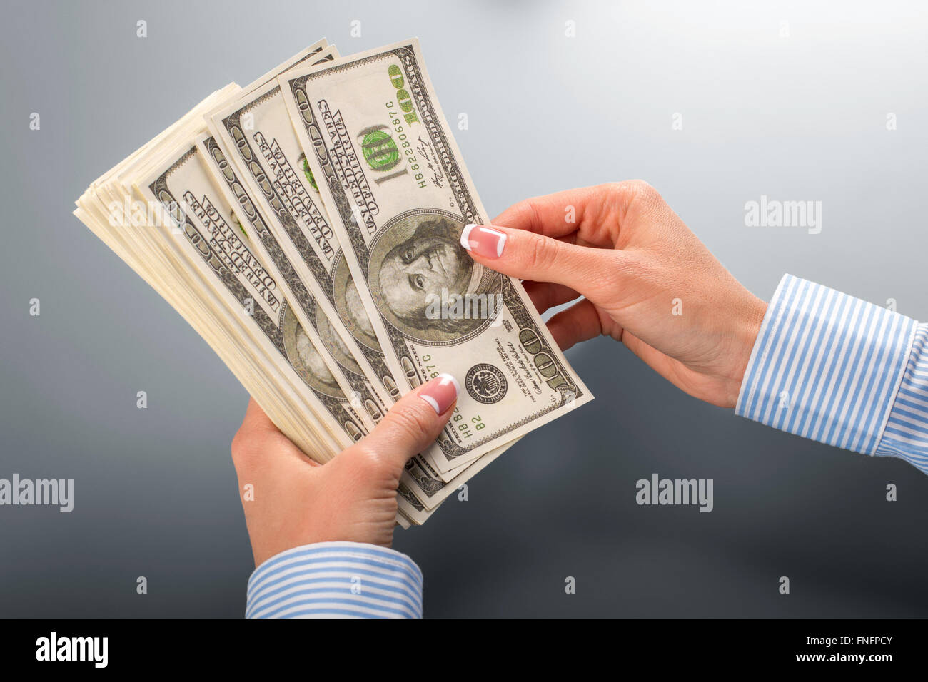 Woman counting bunch of dollars. Female hands counting dollars. Let's ...